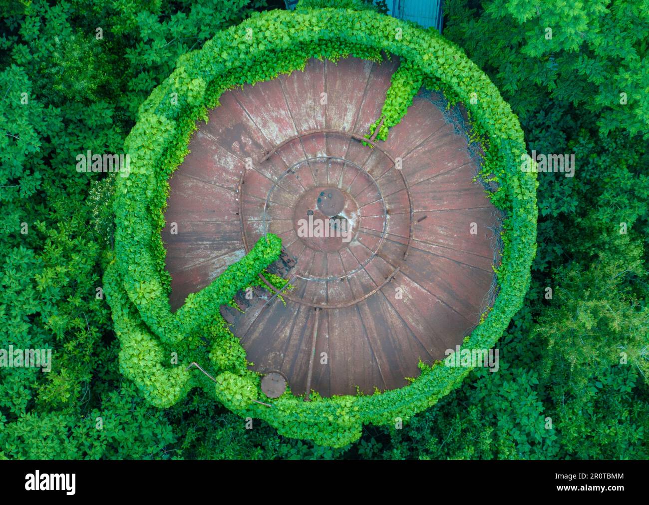 HUAI'AN, CHINA - MAY 9, 2023 - A row of abandoned oil tanks is filled ...