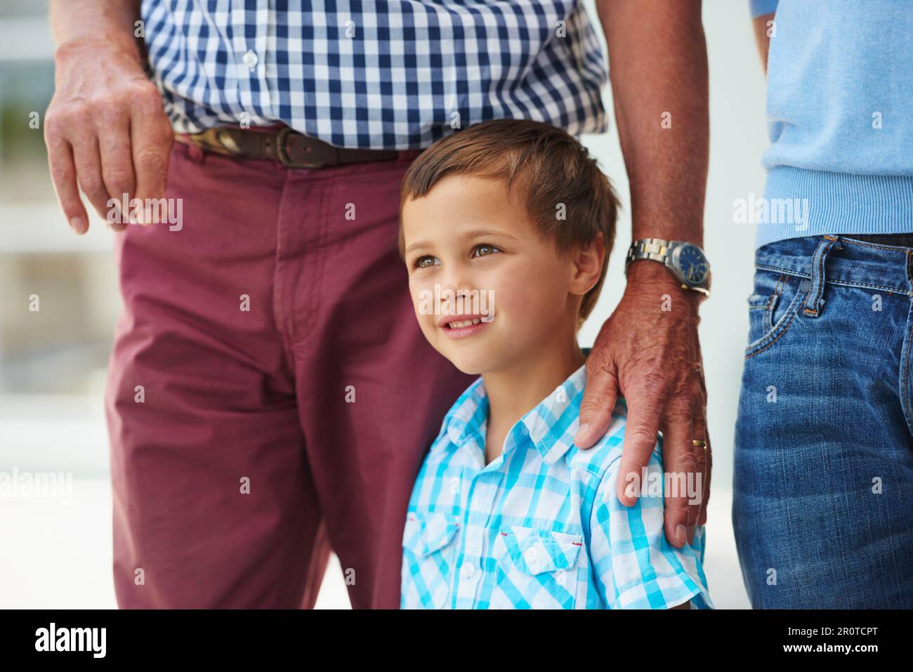 Adventure awaits...a little boy standing outside with his family Stock ...