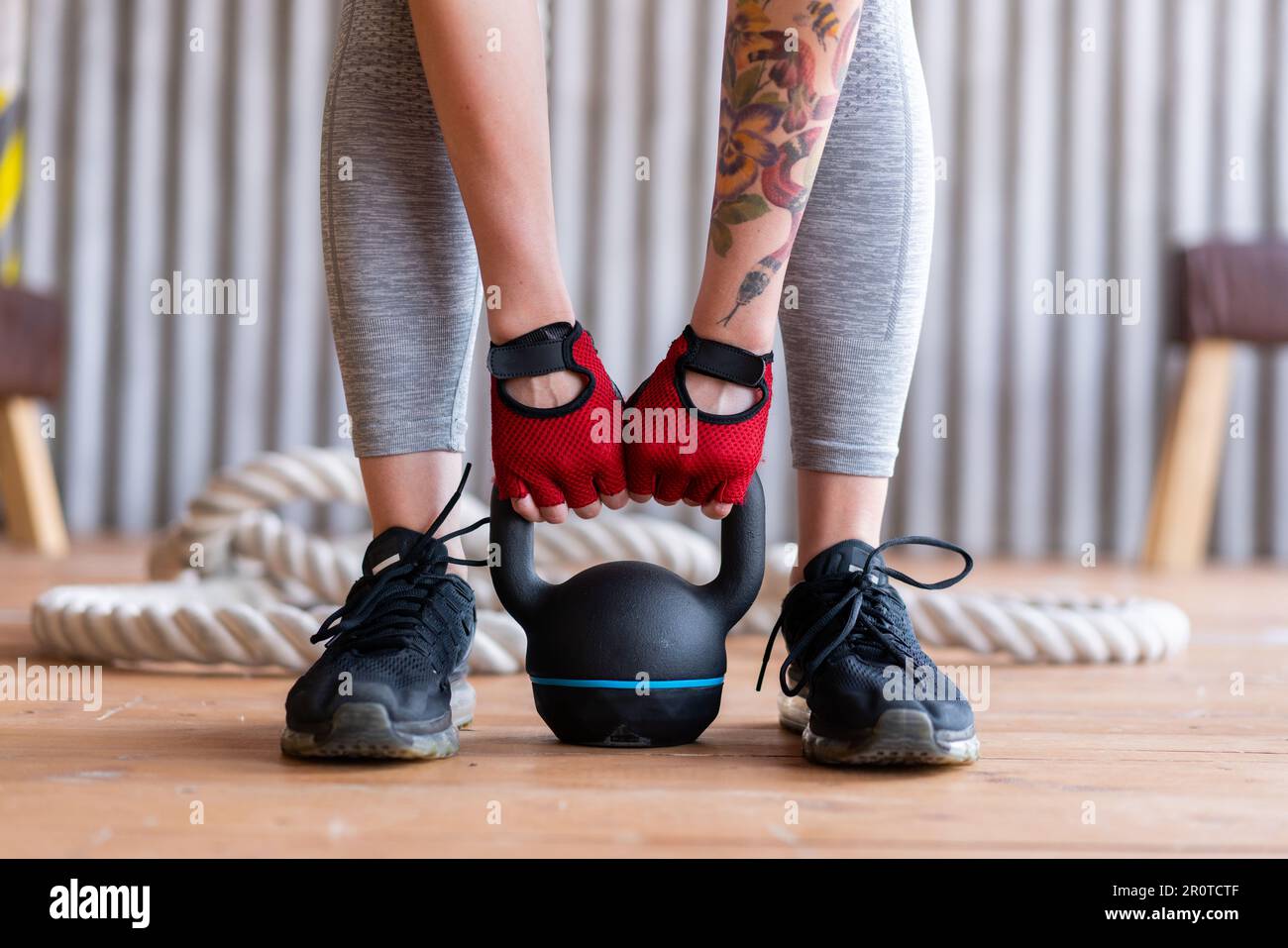 A strong woman trains in the gym. Crossfit training Stock Photo - Alamy
