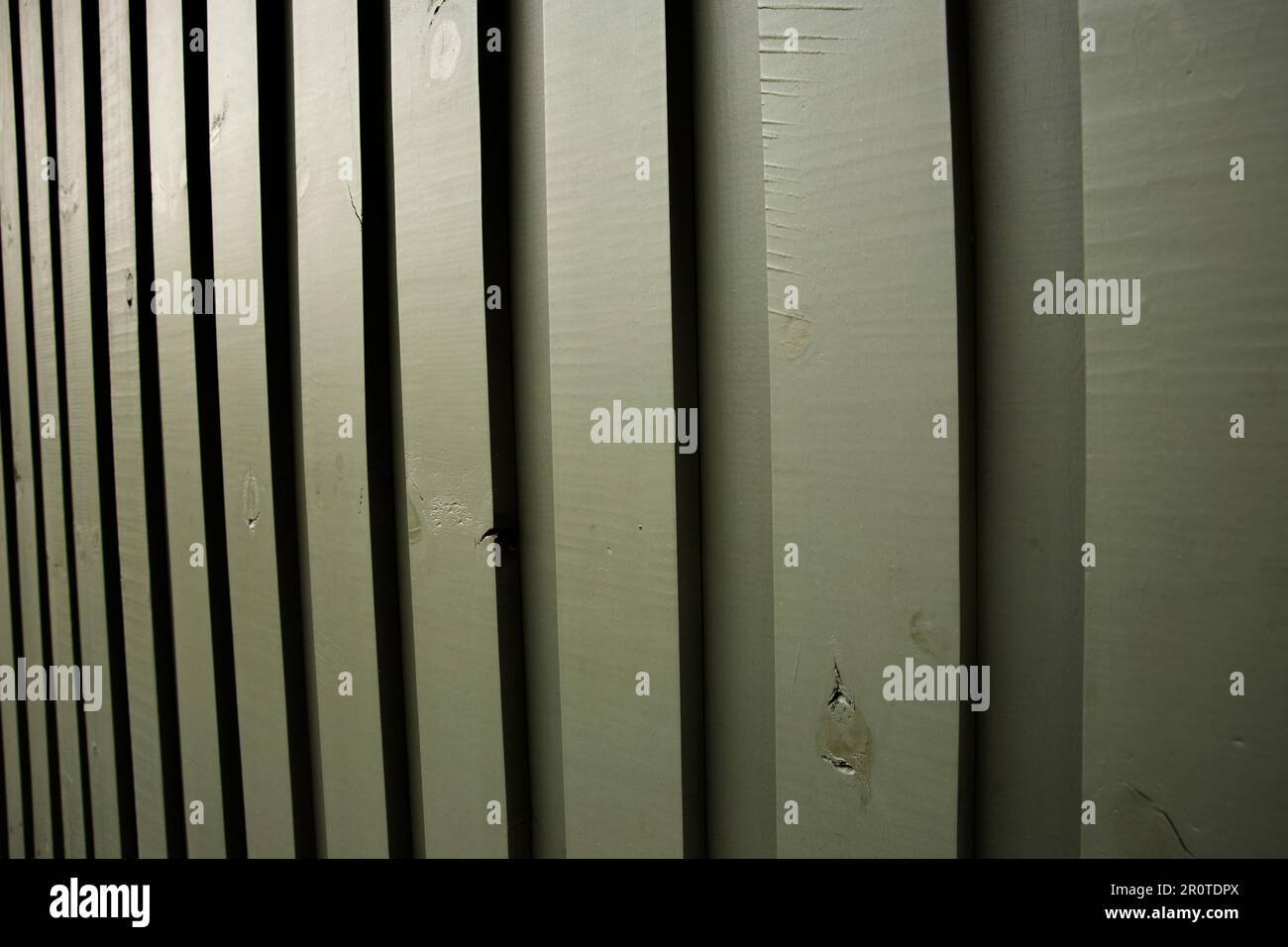 close up of vertical parallel lines of exterior wood paneling or siding ...