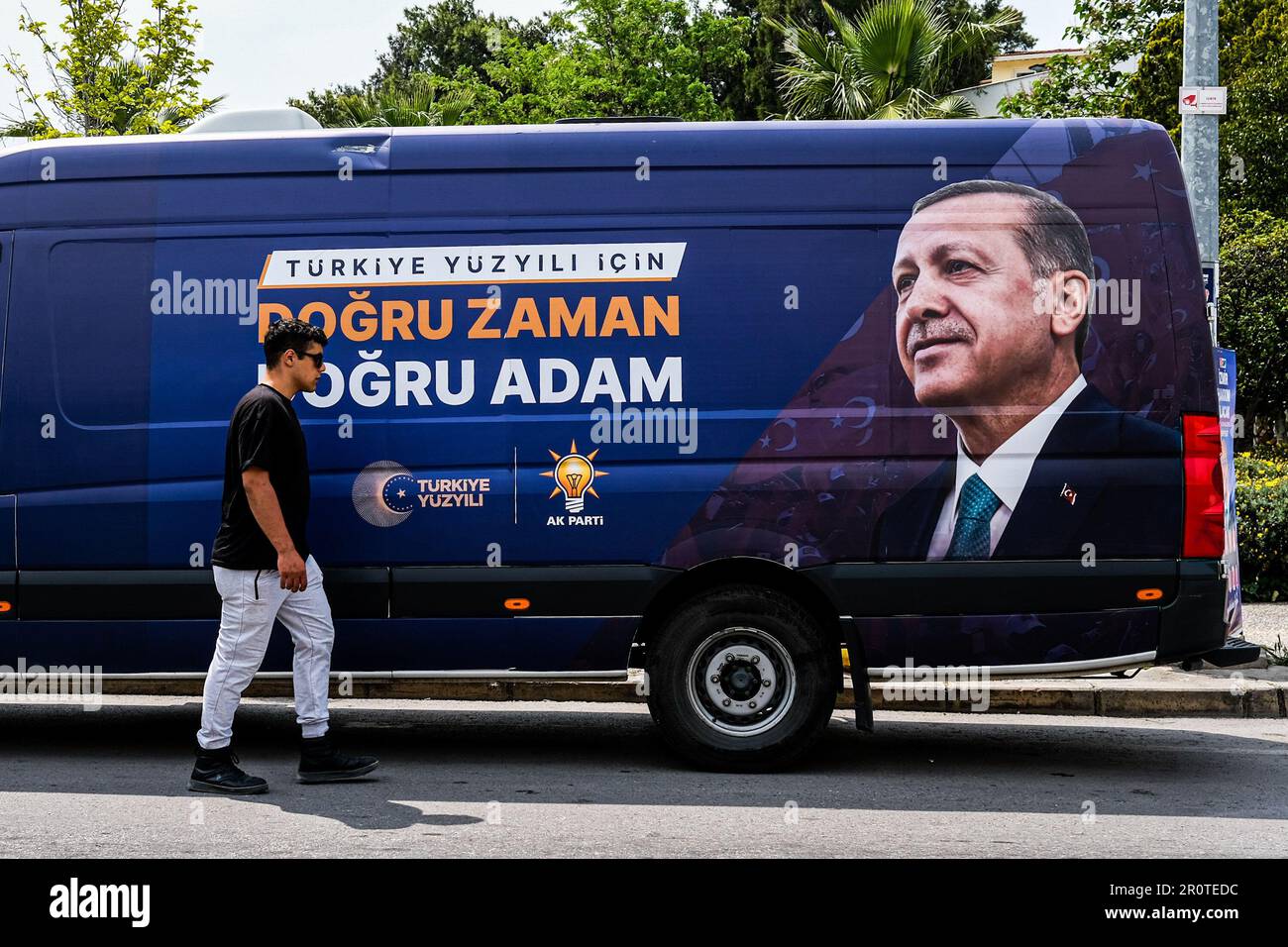 Izmir, Turkey. 09th May, 2023. A person walks past Recep Tayyip Erdogan ...