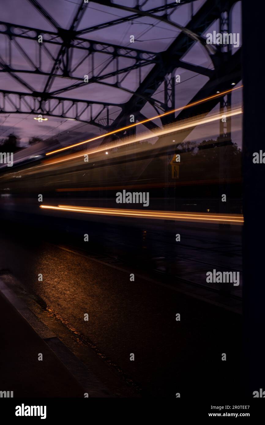 Defocused Lights of cars at night in Krakow bridge. Street line lights ...