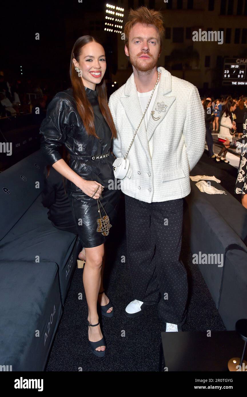 Claudia Sulewski, left, and FINNEAS attend the Chanel Cruise 2023/2024 ...