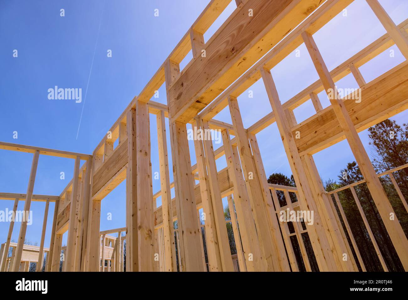 In construction of new home frame house is built with wooden beams ...