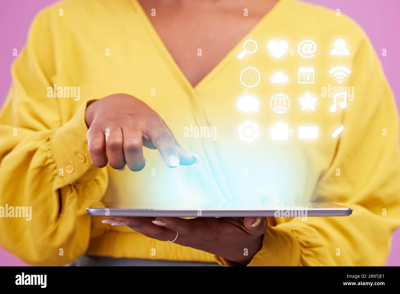 Holographic icons, tablet and woman hand isolated on studio background ...