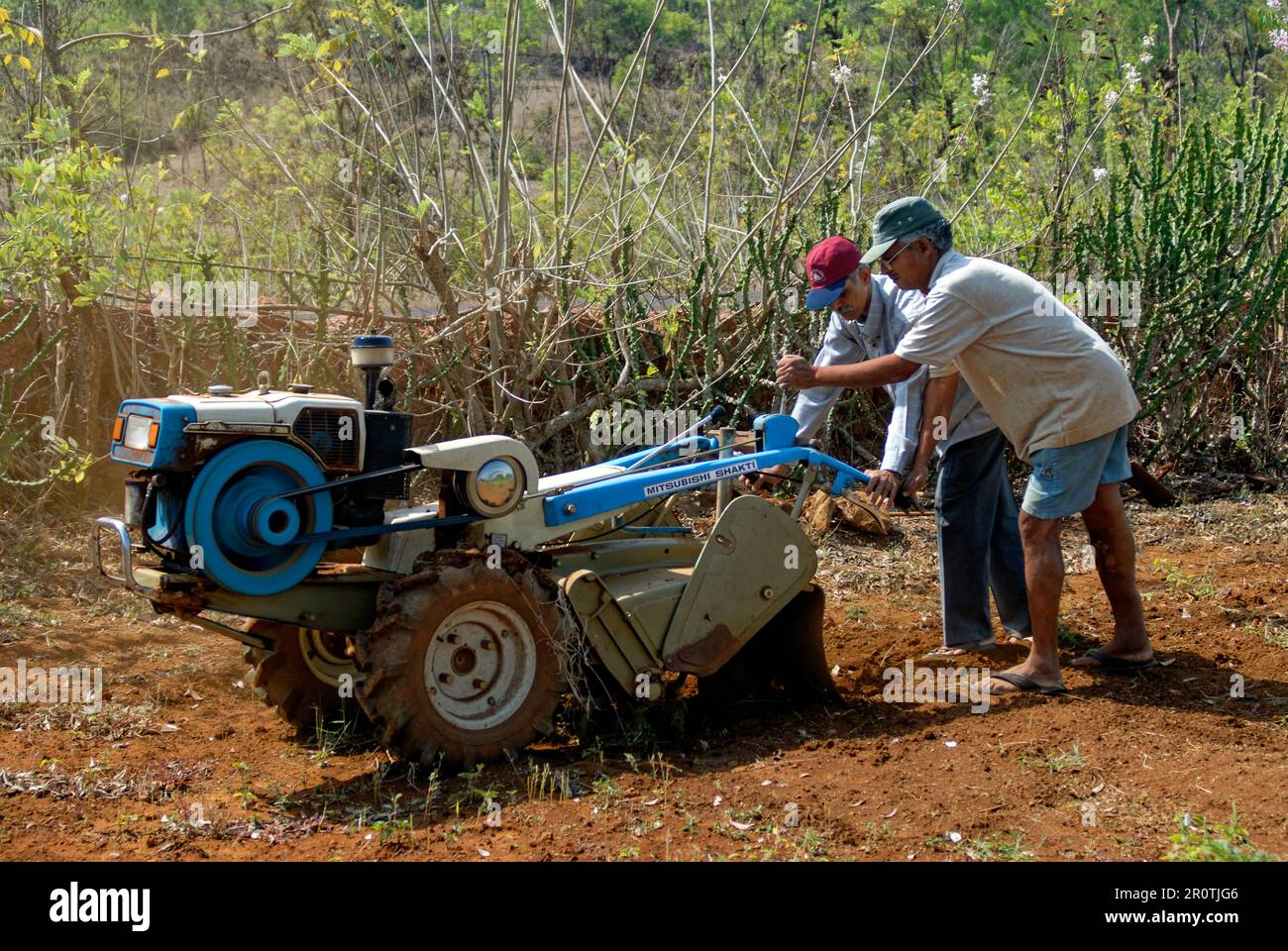 A farmer and the instructor in field with powertiler village lanja ...