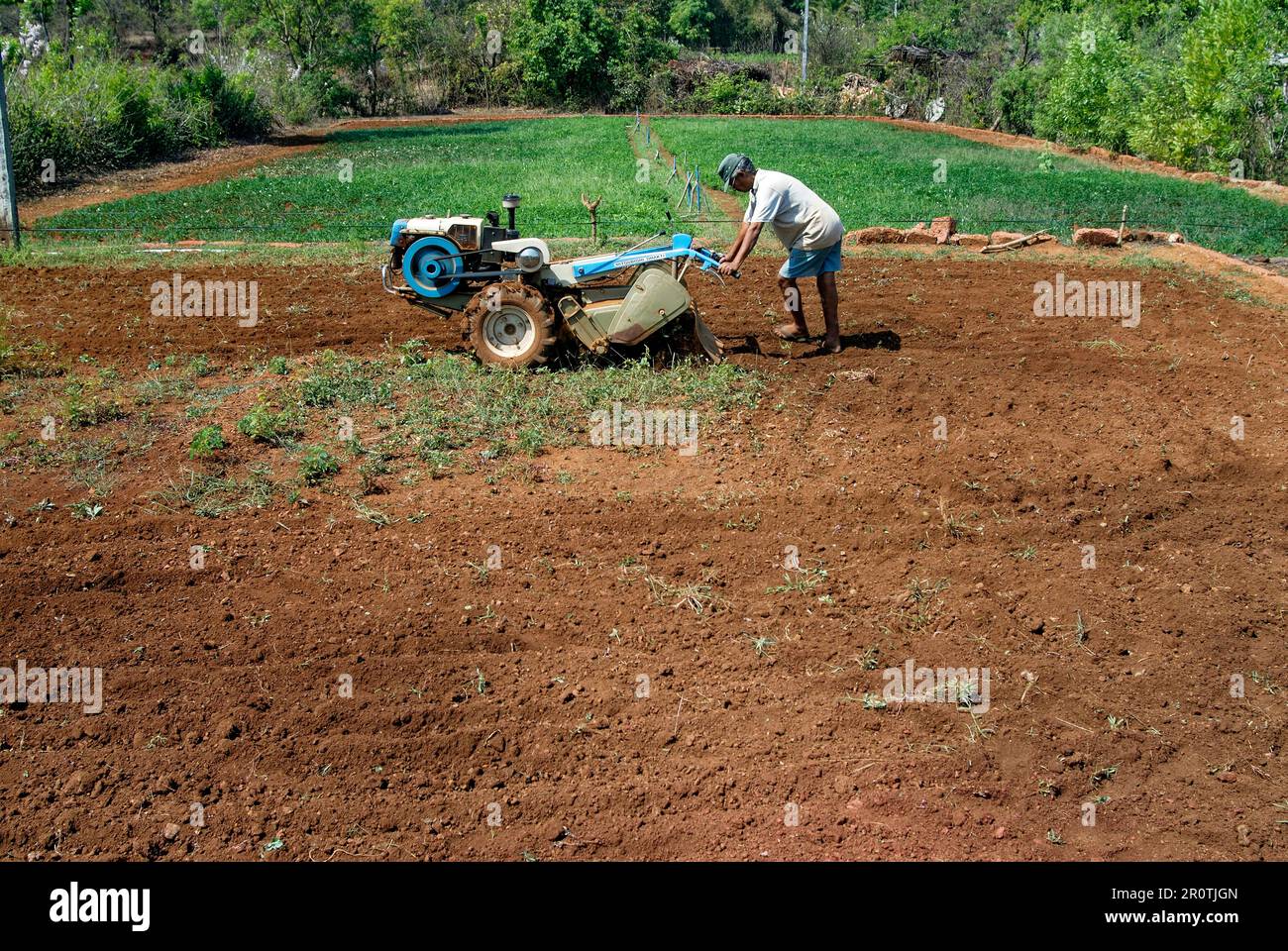A farmer in field with powertiler village lanja taluka lanja district ...