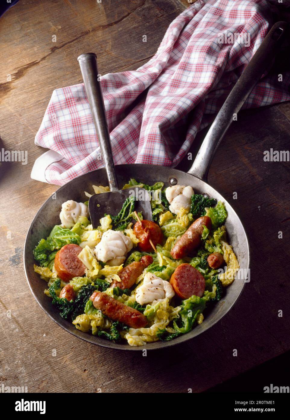 Angler fish with sausage and cabbage Stock Photo - Alamy