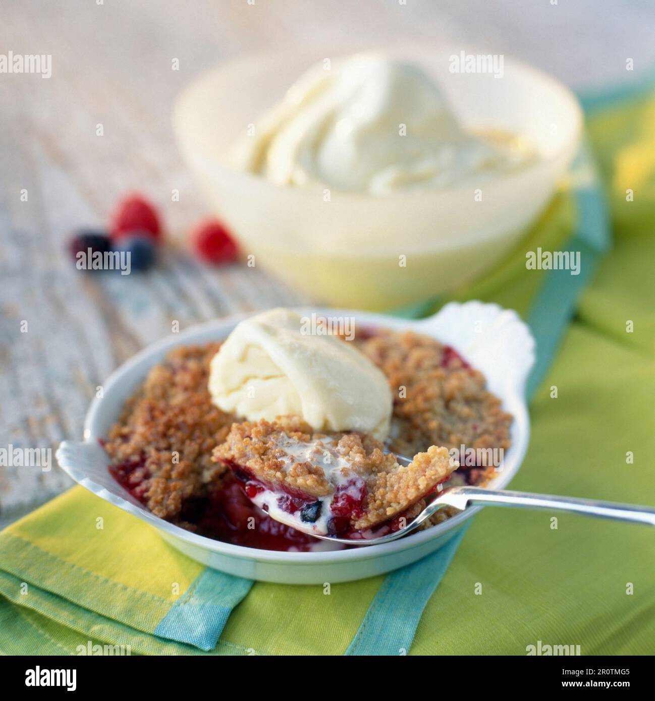 Summer fruit crumble with lemon and verbana ice cream Stock Photo - Alamy