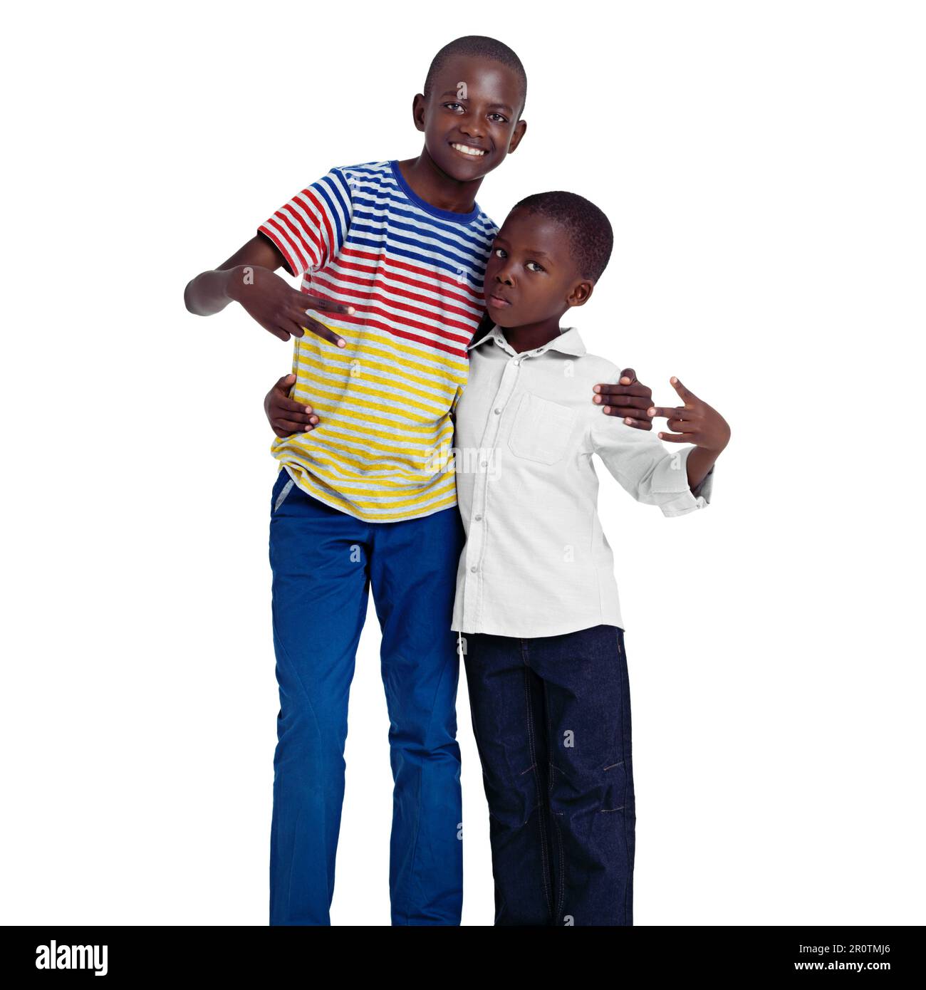No sibling rivalry here. Studio shot of two african siblings against a ...