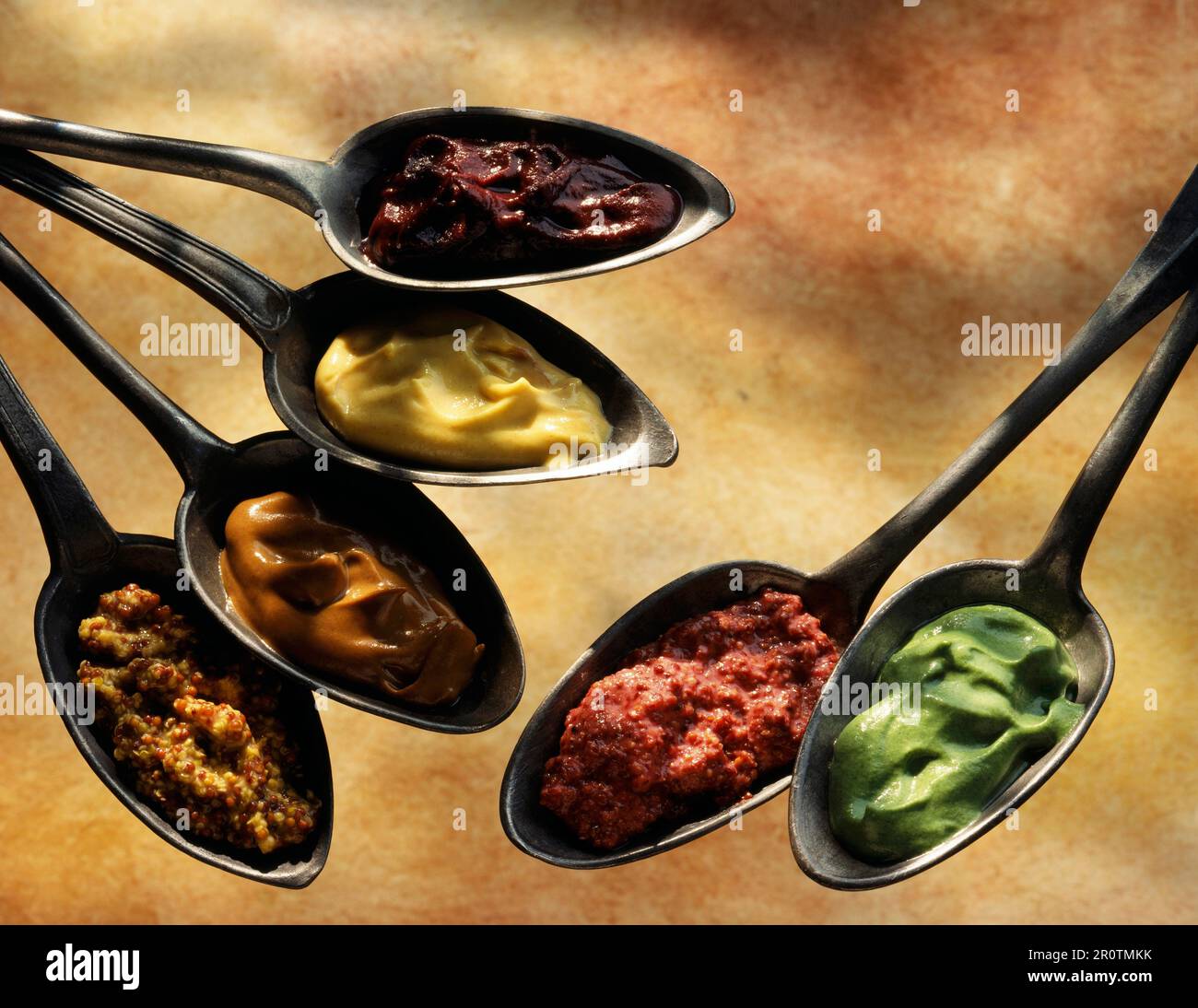 Selection of mustards in spoons Stock Photo - Alamy