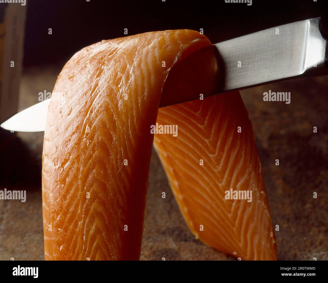 Salmon fillet on knife Stock Photo - Alamy