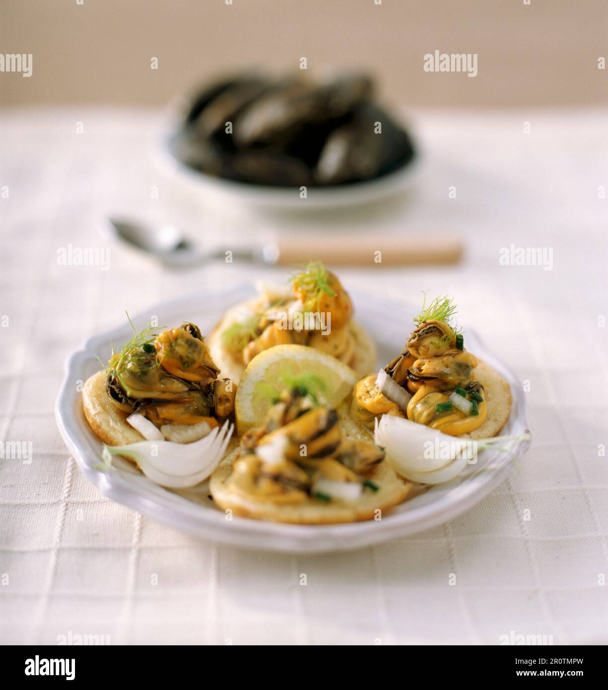 Raw mussels marinated in lemon juice Stock Photo - Alamy