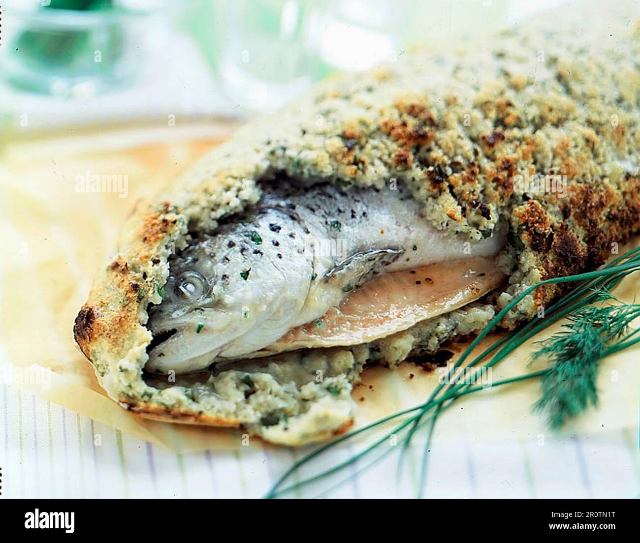 A whole salmon in a salt coating Stock Photo - Alamy