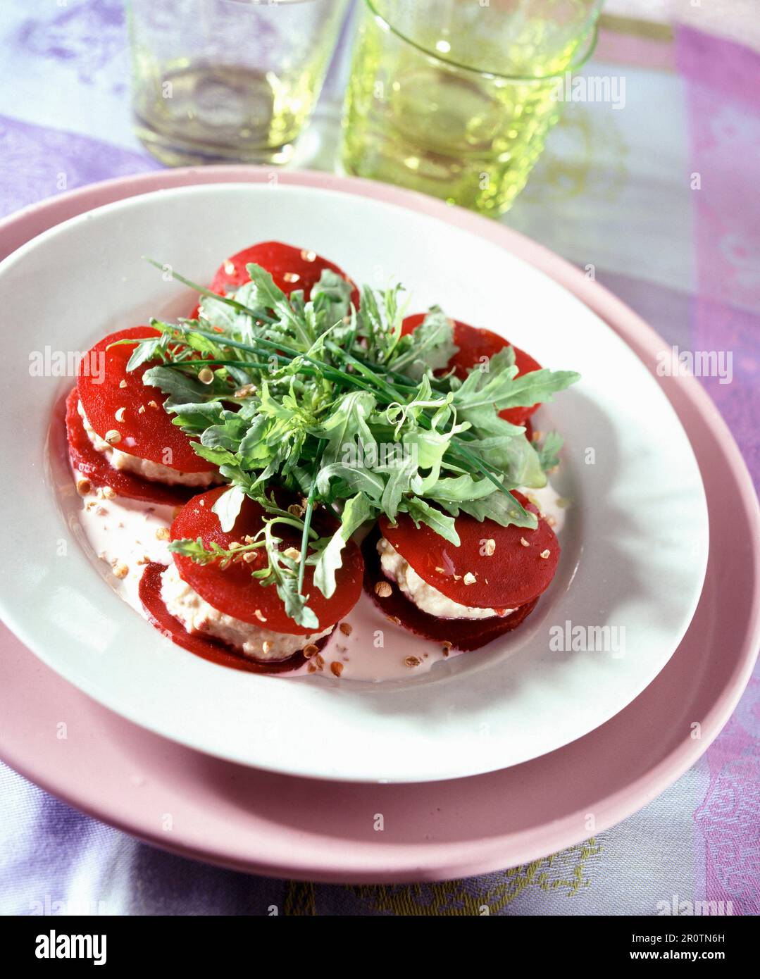 Thinly sliced beetroot with eggplant caviar and white pepper Stock ...