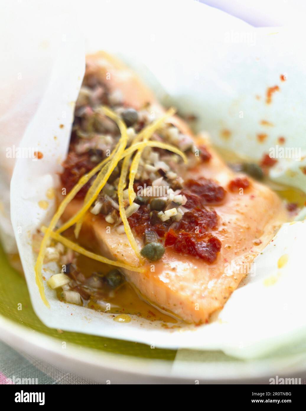 Trout with capers cooked in wax paper Stock Photo - Alamy