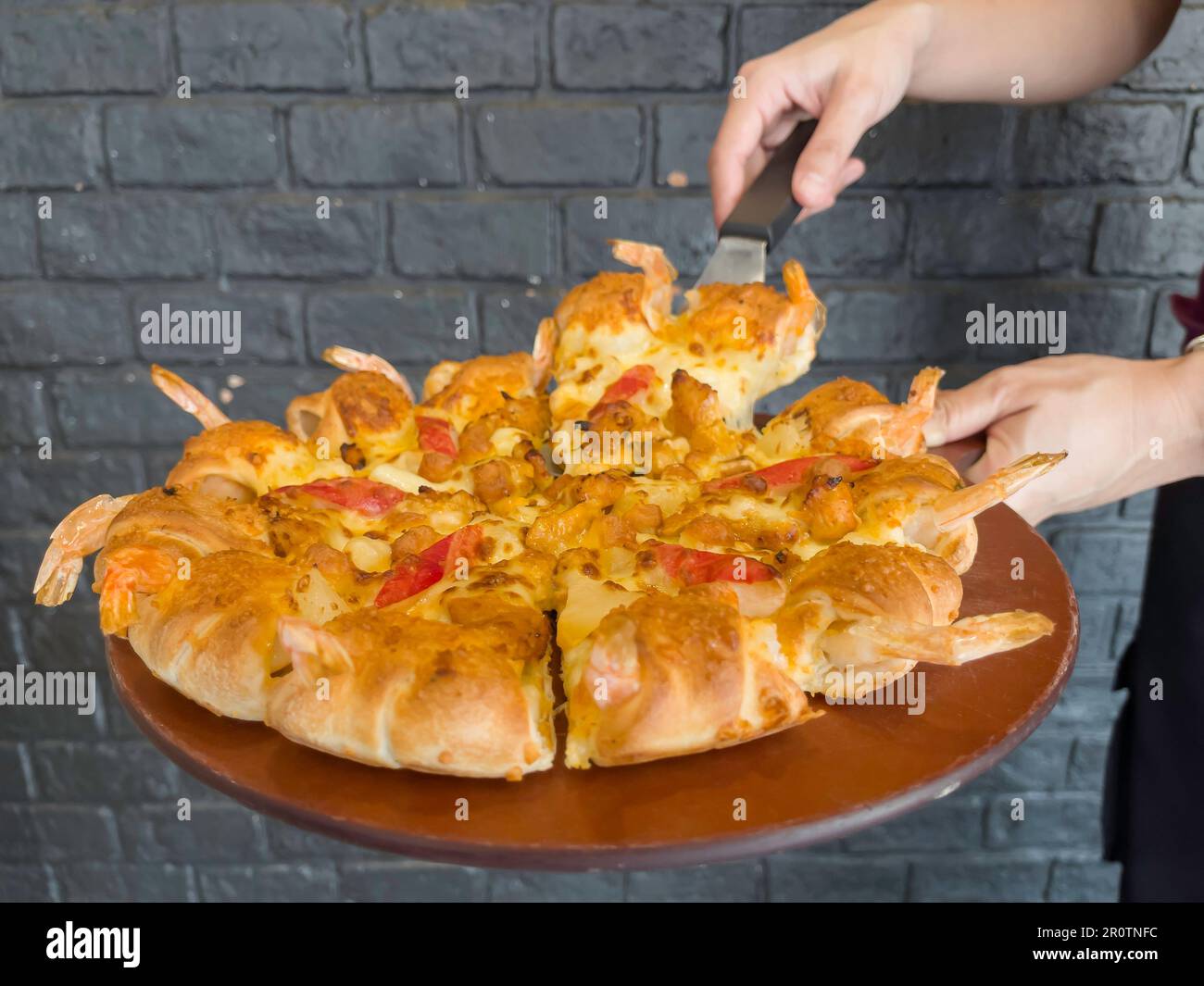 International franchise restaurant chain offers styles of pizza, stock ...