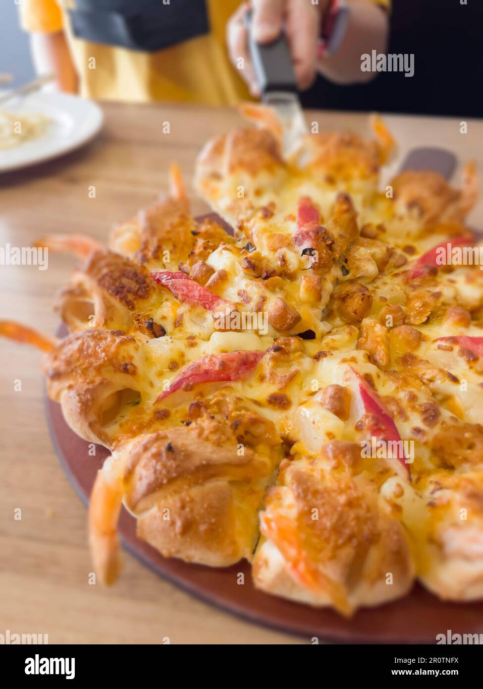 International franchise restaurant chain offers styles of pizza, stock ...