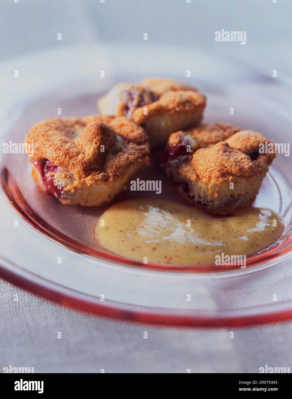 Cherry pudding with custard sauce Stock Photo - Alamy