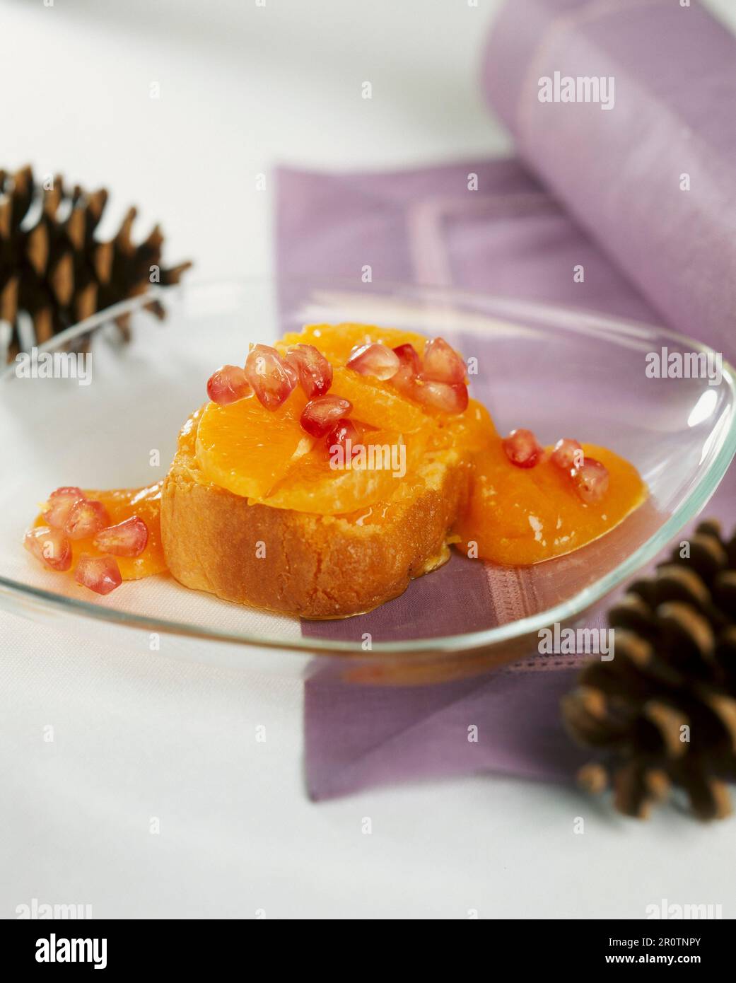 Stewed persimmon, mandarin orange and pomegranate pudding Stock Photo ...