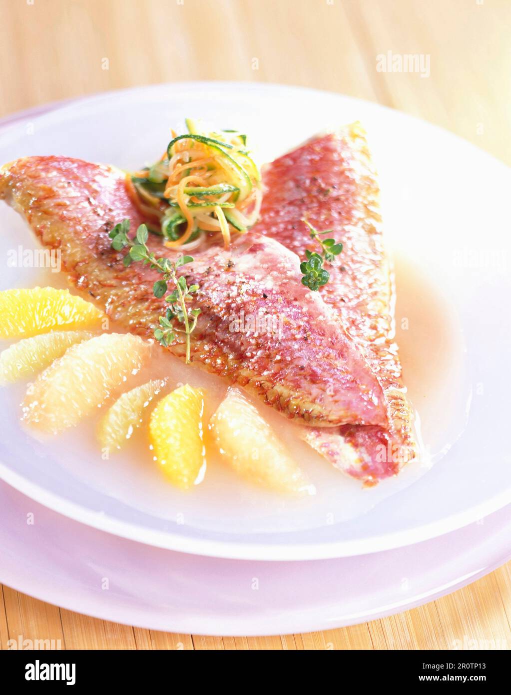Red mullet fillets with citrus fruit Stock Photo - Alamy