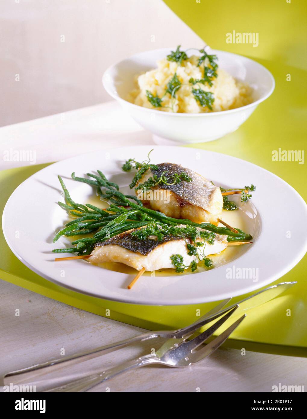 Piece of fish with seaweed Stock Photo - Alamy