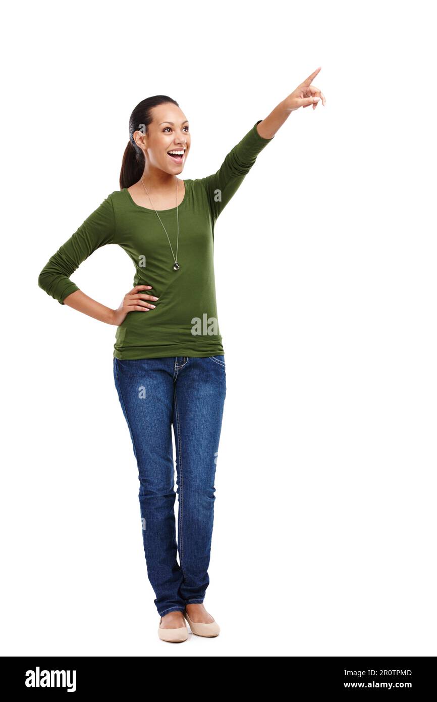 The subtle distraction. an attractive young woman standing and pointing ...