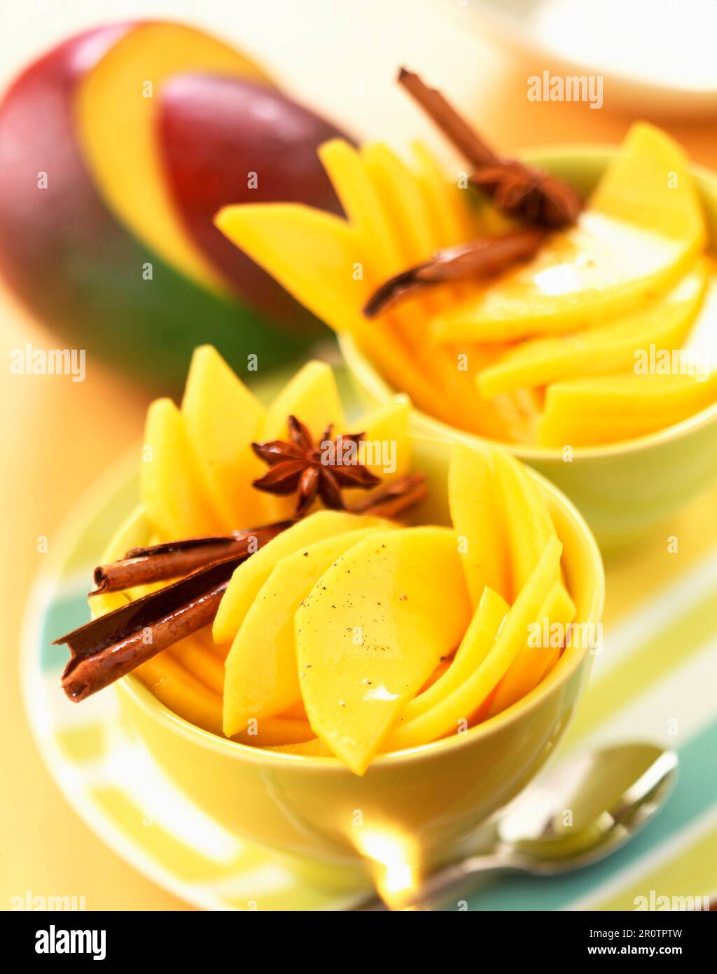 Dishes of fresh sliced mangoes with spices Stock Photo - Alamy
