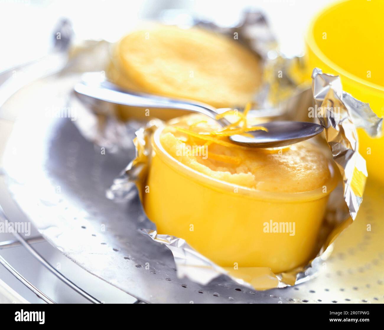 Individual lemon flans in foil Stock Photo - Alamy