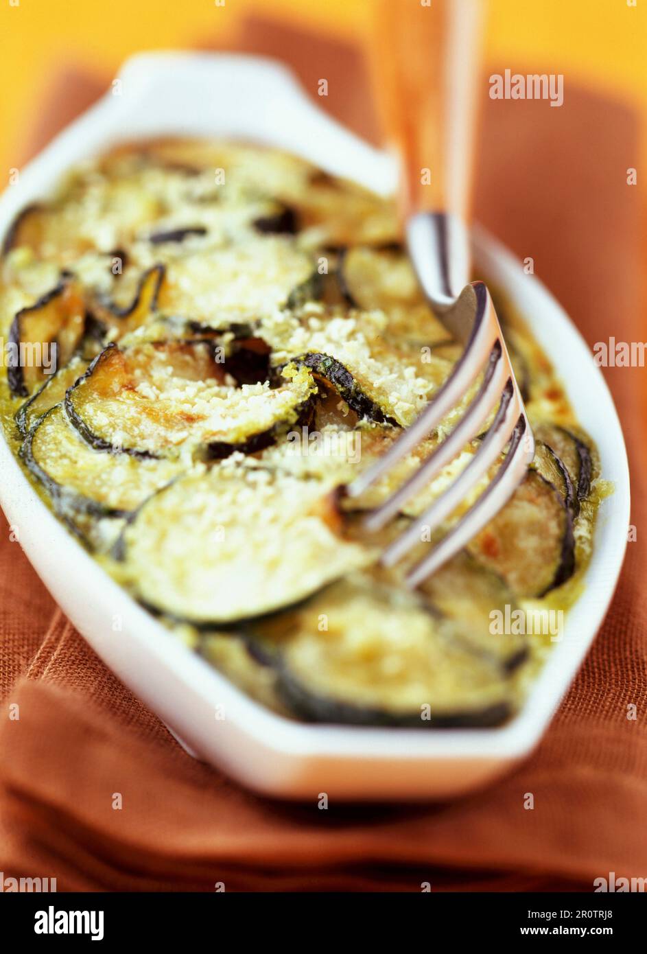 Crispy courgette and Parmesan cheese gratin Stock Photo - Alamy