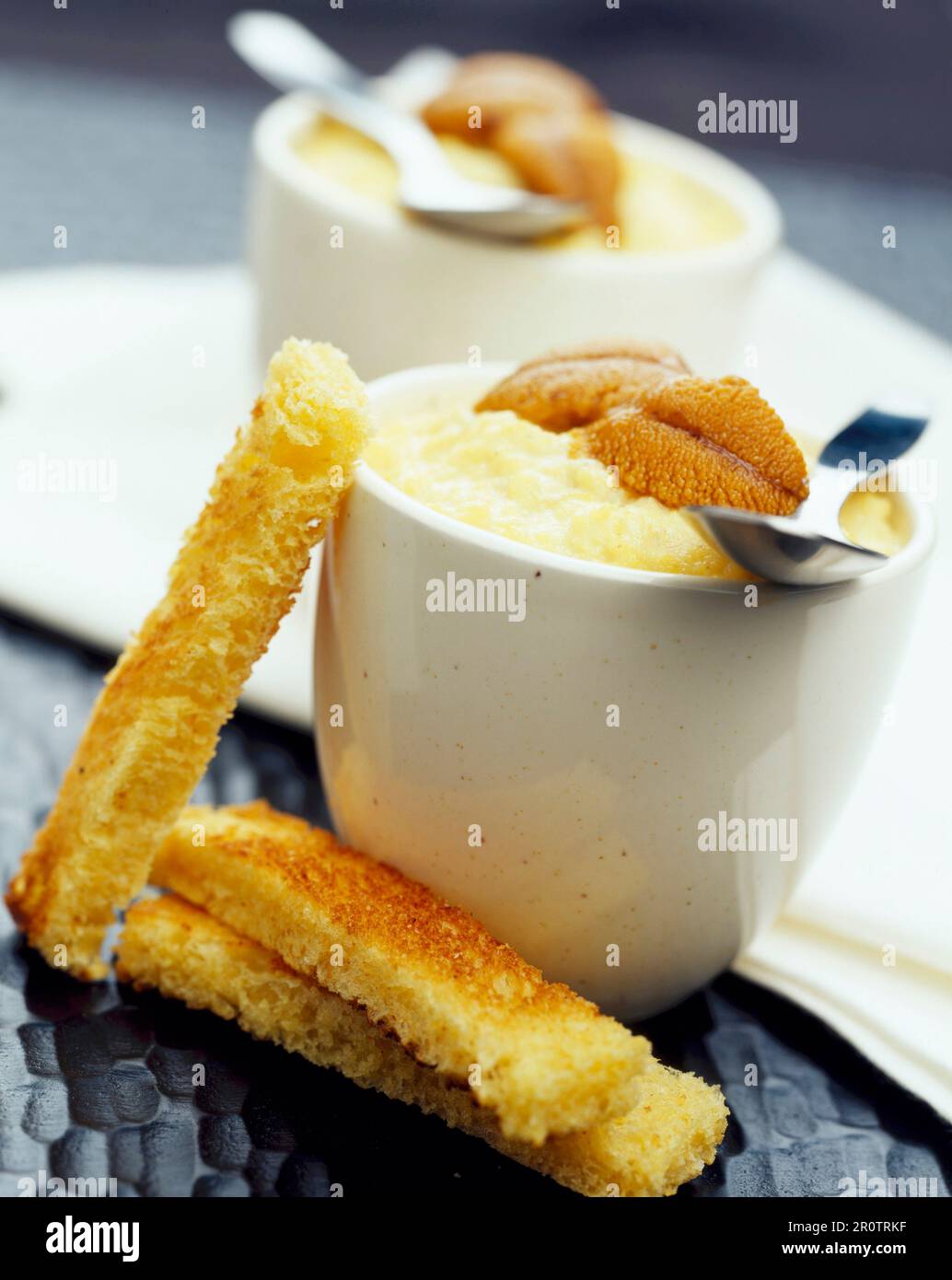 Scrambled egg with sea urchin roe Stock Photo - Alamy