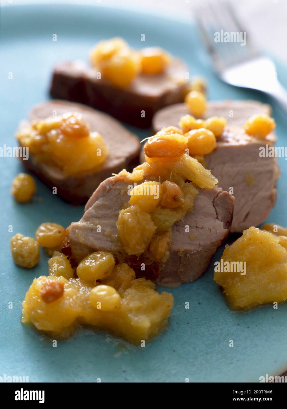 Pork filet mignon with pineapple chutney, raisins and ginger Stock ...