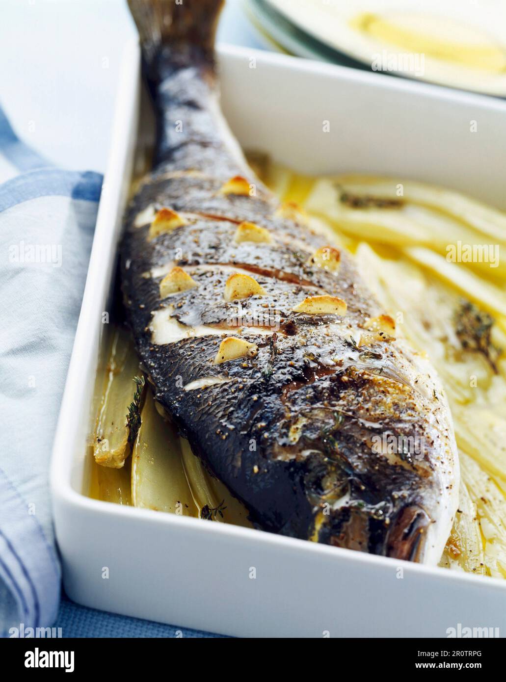 Garlic roasted sea bream Stock Photo - Alamy