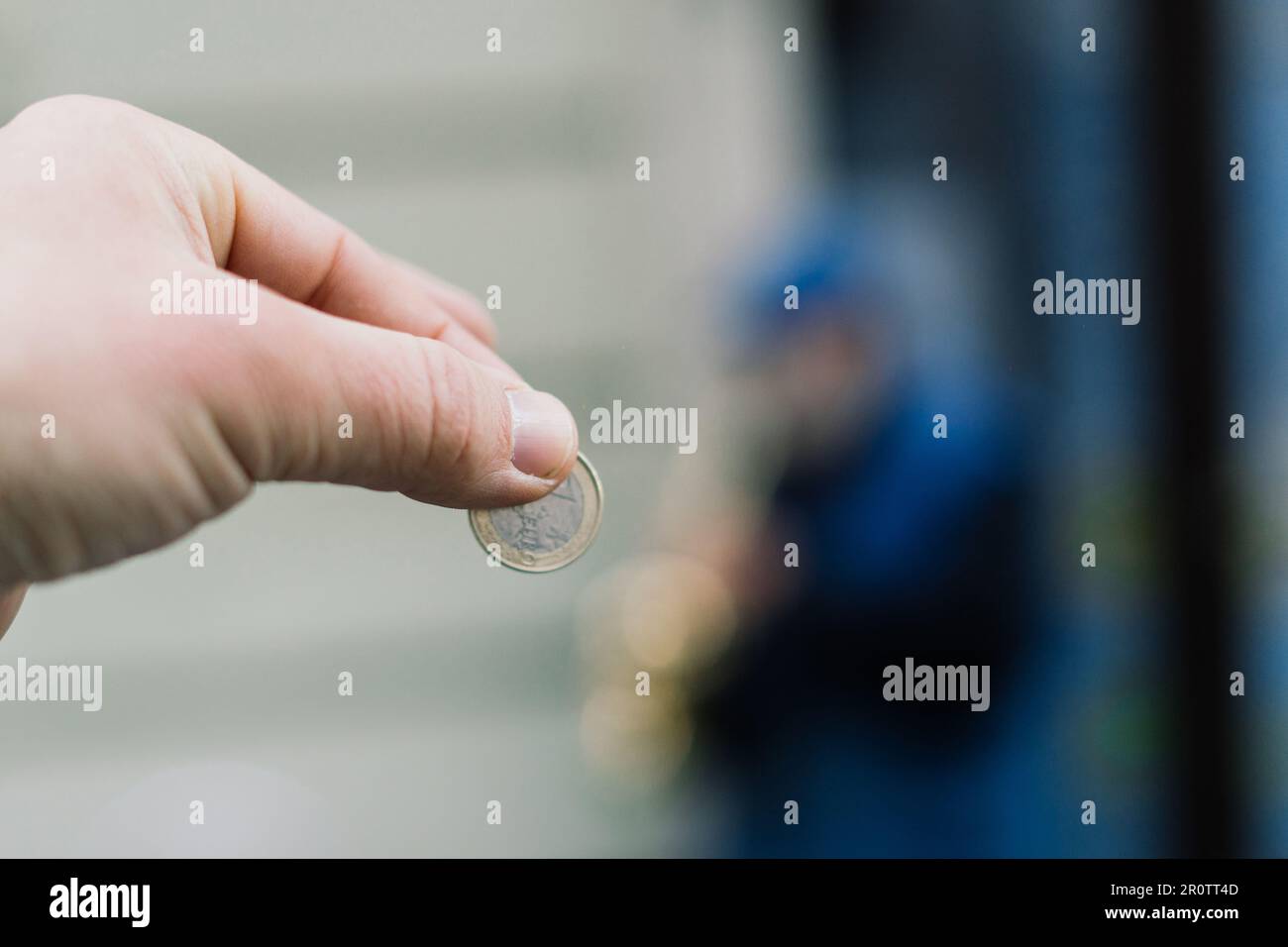 Street old performer musician plays saxofon blurred, coin in a hand ...