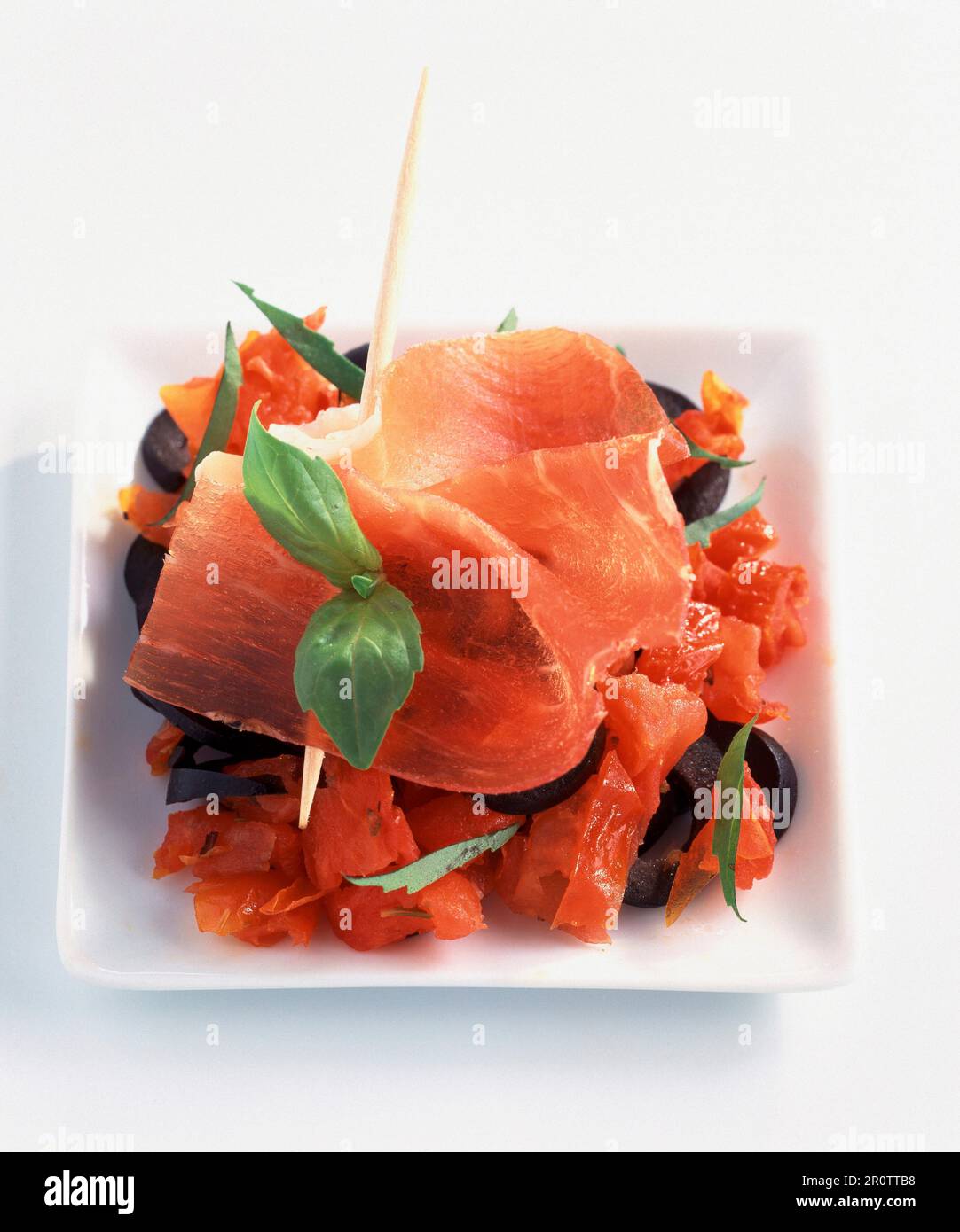 Raw ham and dried tomato tapas Stock Photo - Alamy