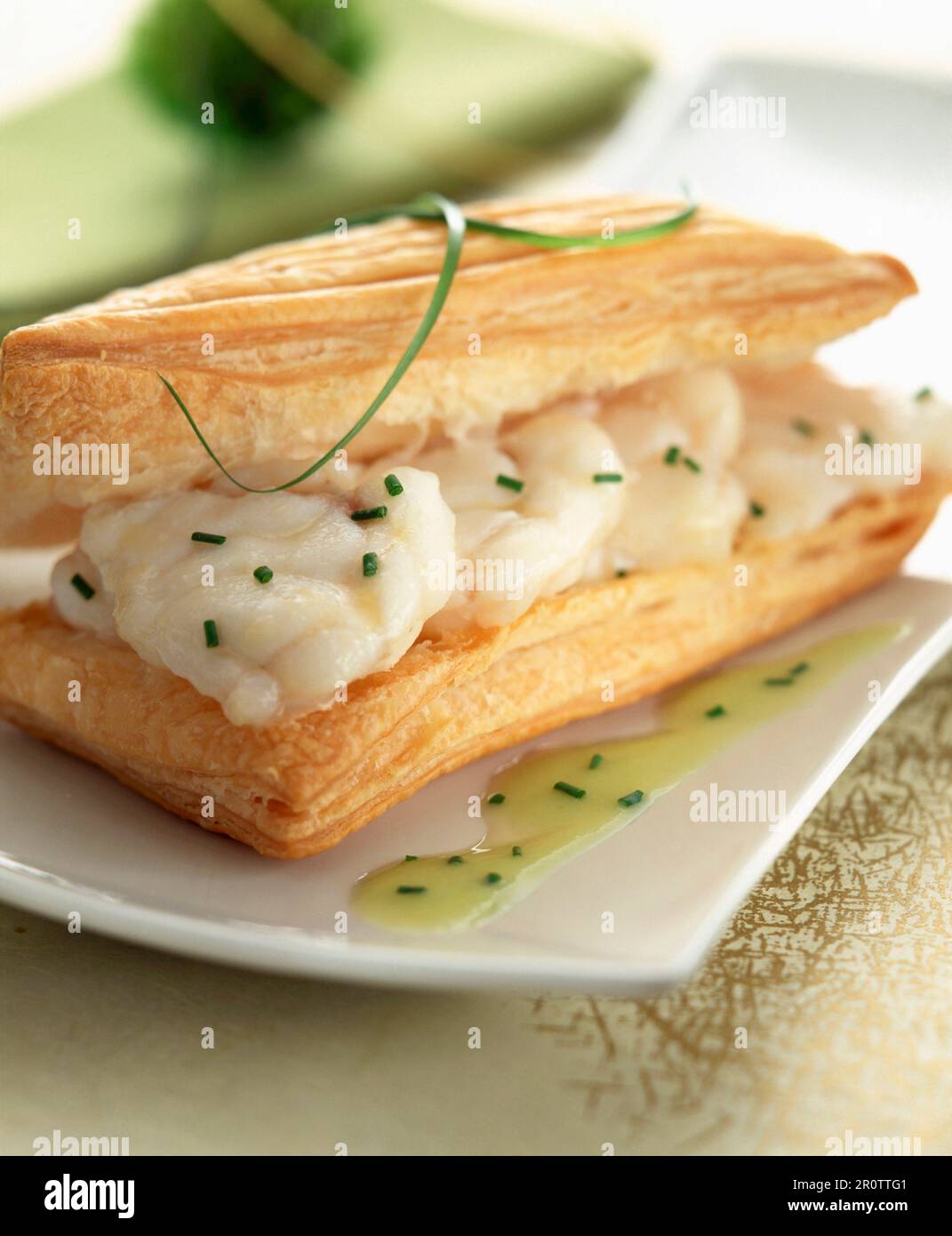 Puff pastry case filled with monkfish and asparagus sauce Stock Photo ...