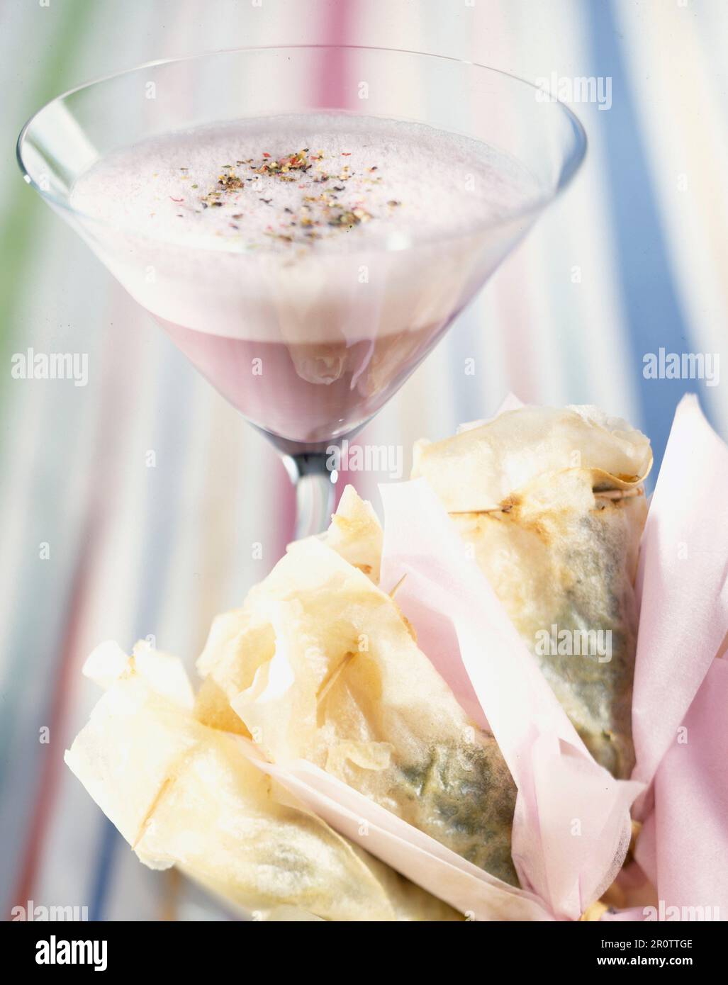 Pink cocktail and spinach filo pastry pies Stock Photo - Alamy
