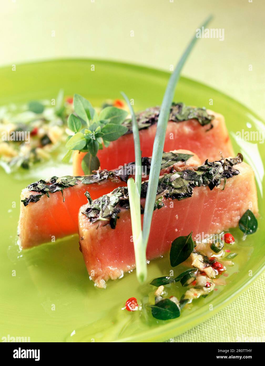 Half-cooked tuna with herb crust Stock Photo - Alamy