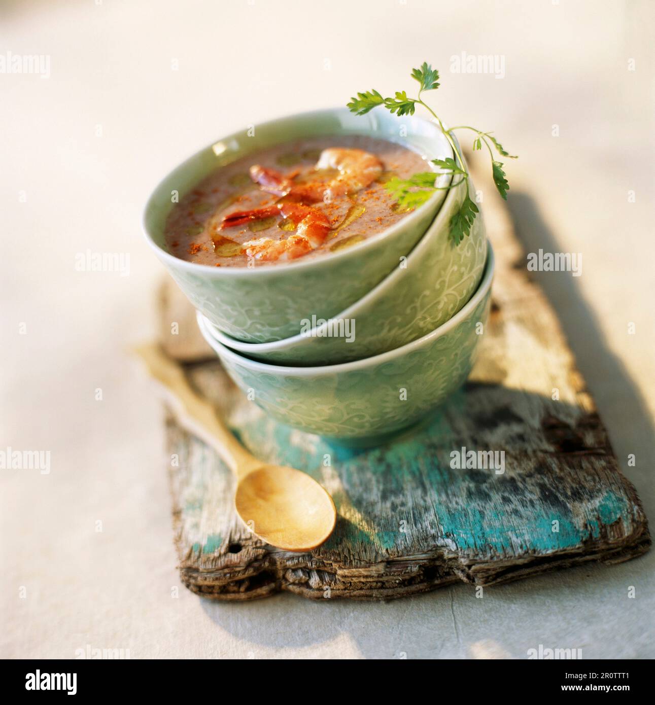 Creamed red rice soup with lemon grass and grilled prawns Stock Photo ...