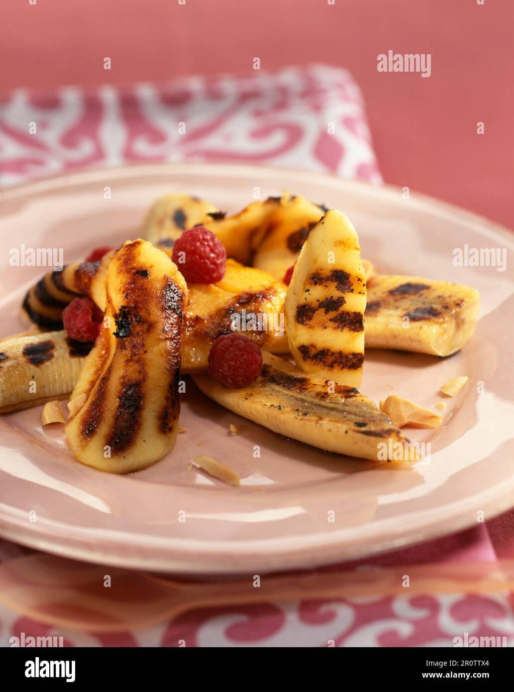 grilled bananas with raspberries Stock Photo - Alamy