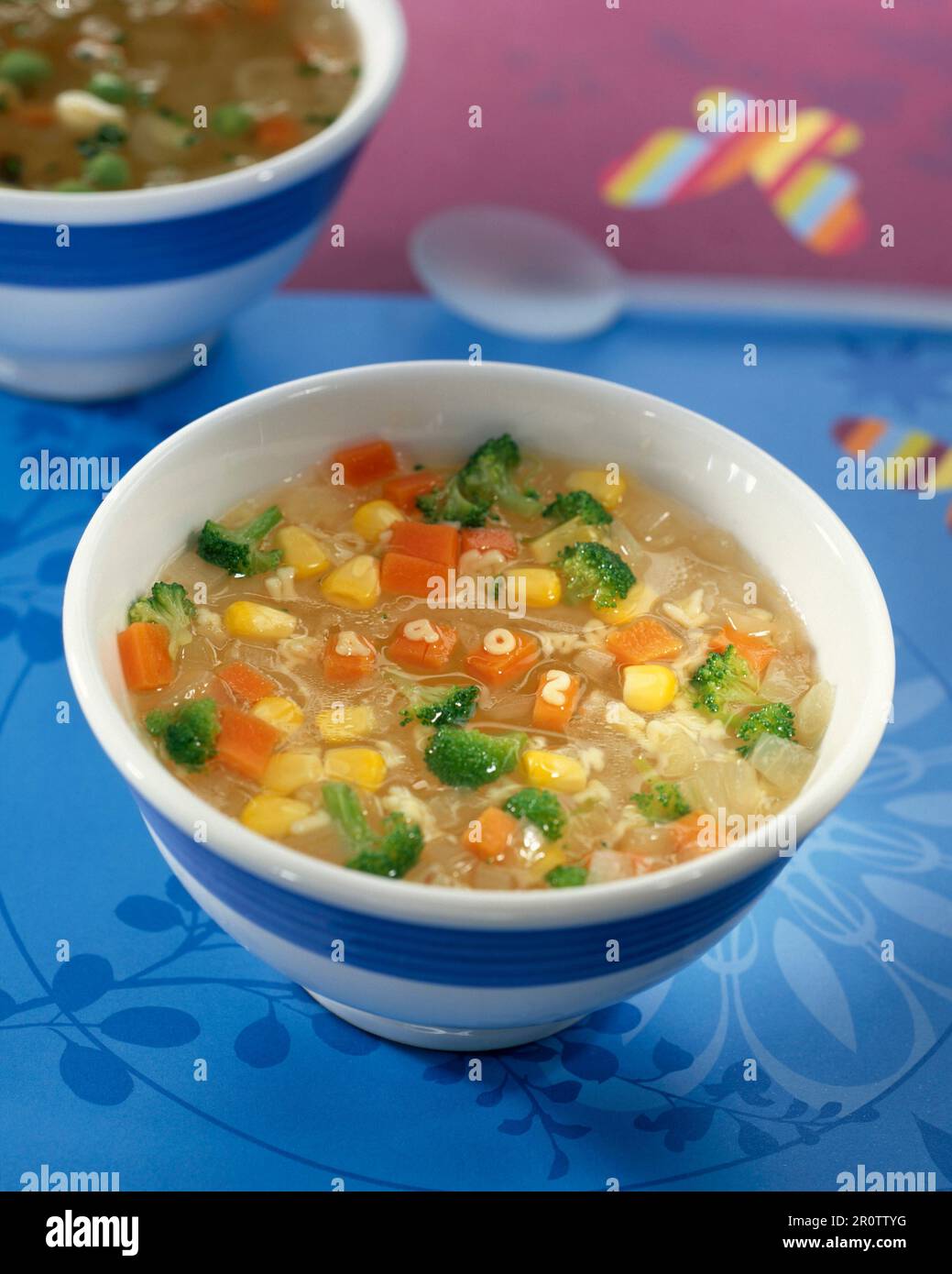 Vegetable soup with alphabet pasta Stock Photo - Alamy