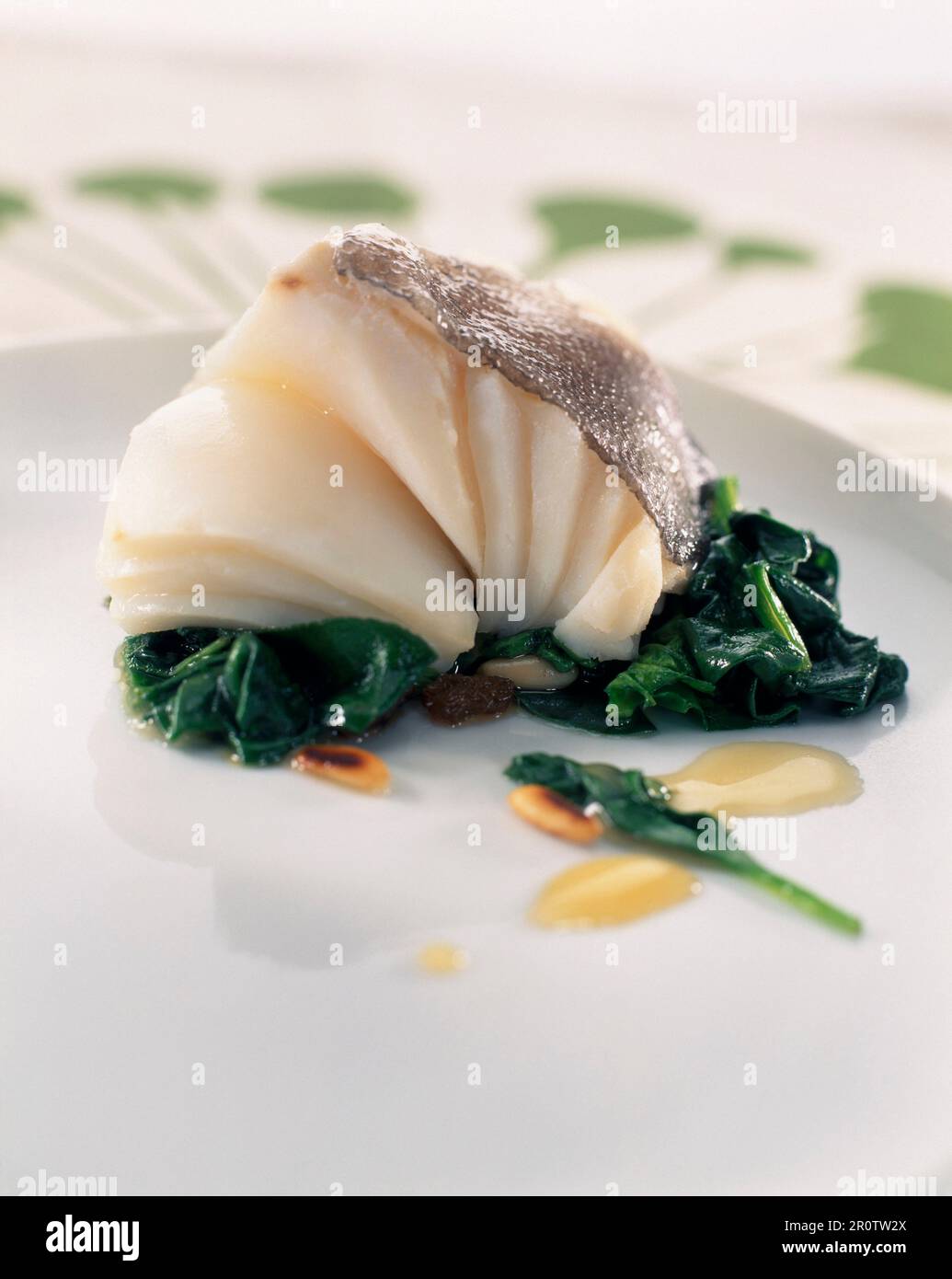 cod with honey and spinach Stock Photo - Alamy