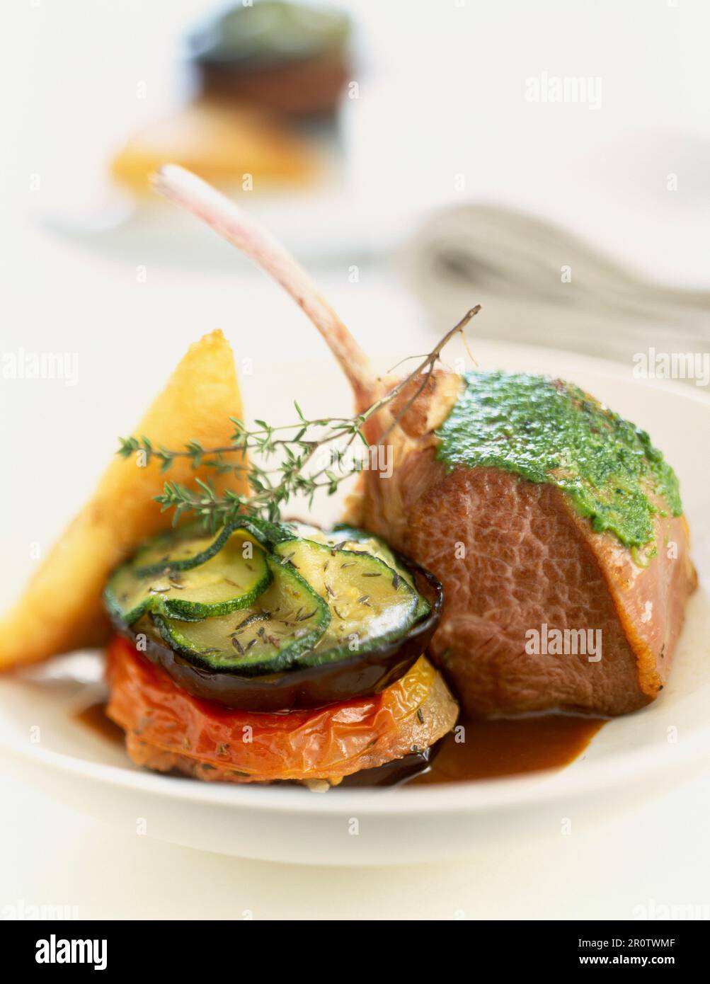 Lamb chop with herbs and vegetable Tian Stock Photo - Alamy
