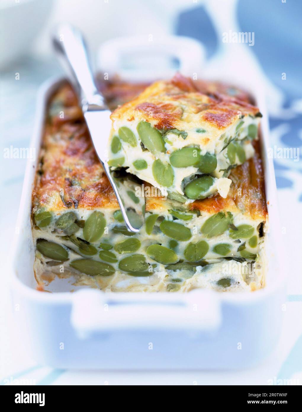 broad bean clafoutis batter pudding Stock Photo - Alamy