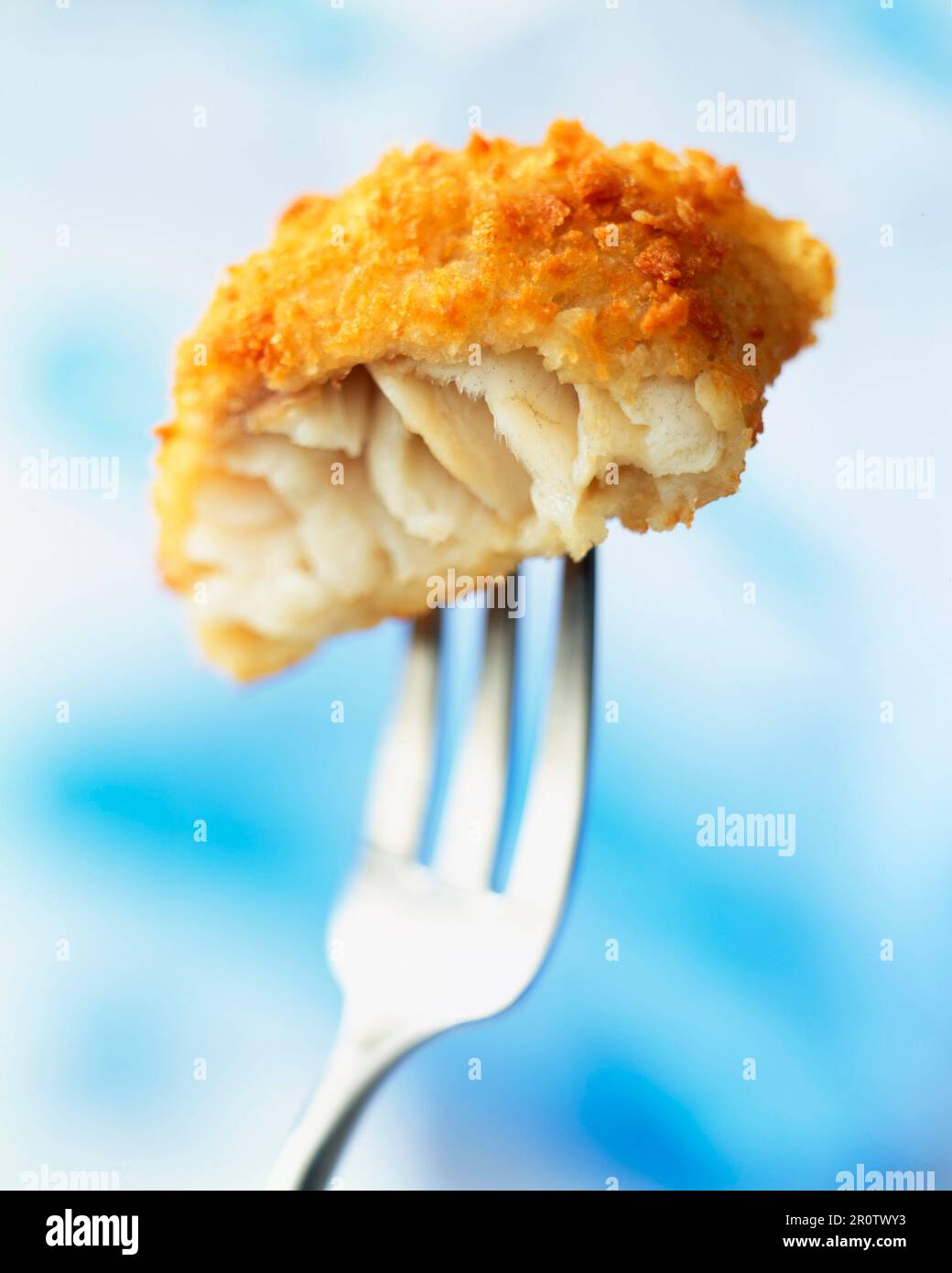 Crunchy breaded cod on fork Stock Photo - Alamy