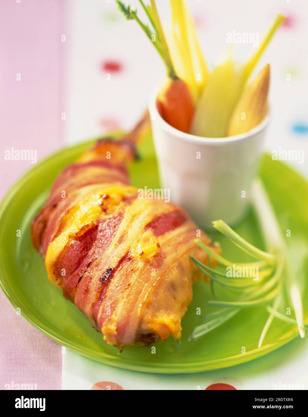 Rabbit leg larded with bacon and cheese Stock Photo - Alamy