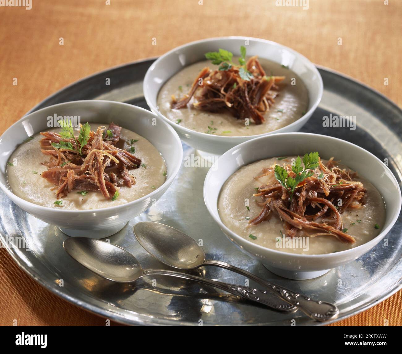 Creamed white haricot beans with shredded preserved duck Stock Photo ...