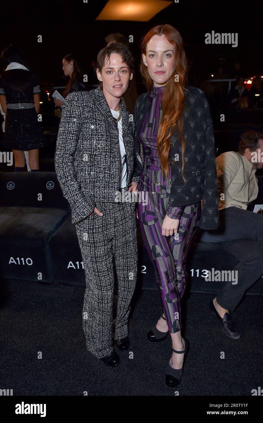 Kristen Stewart, left, and Riley Keough attend the Chanel Cruise 2023/ ...