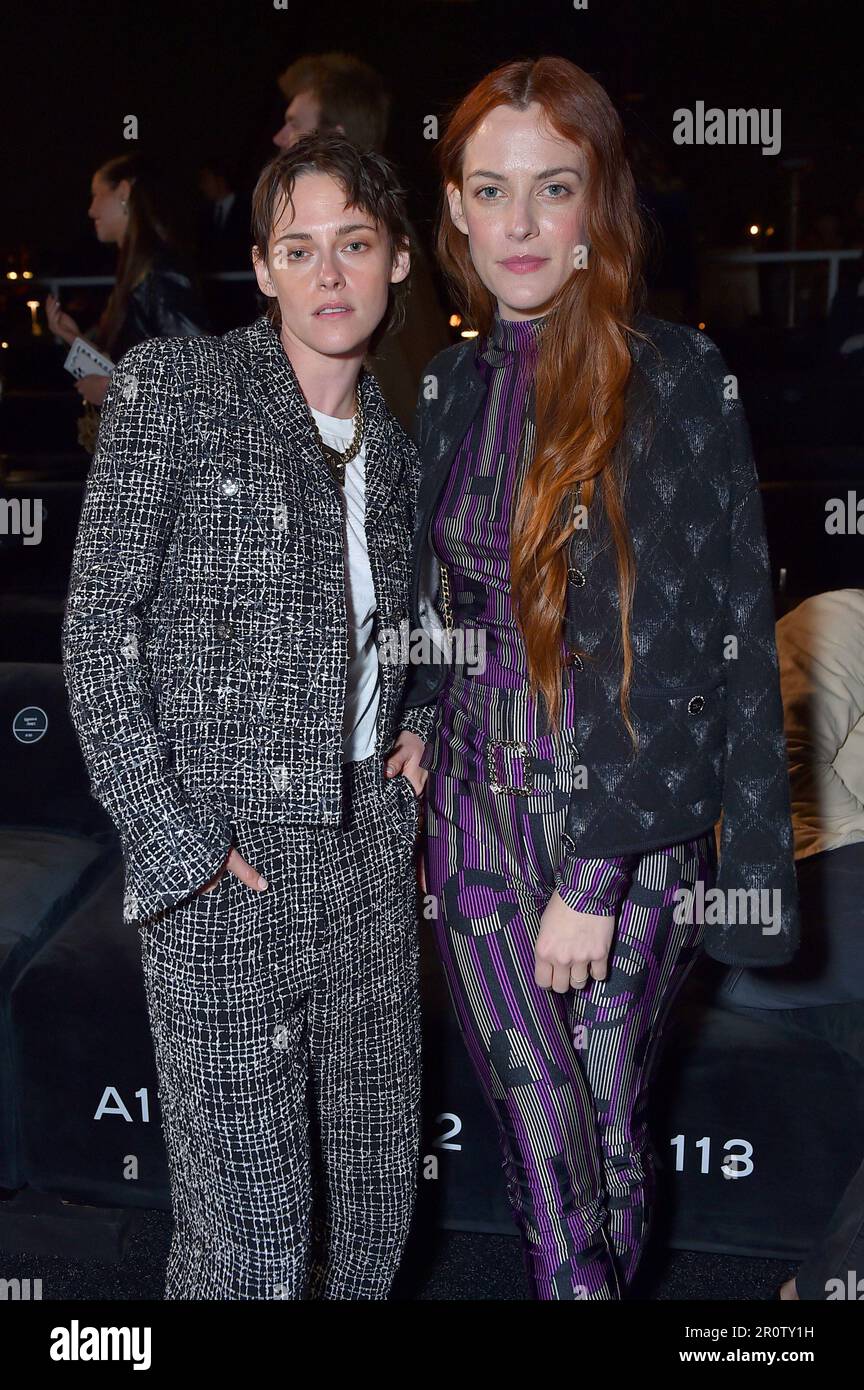 Kristen Stewart, left, and Riley Keough attend the Chanel Cruise 2023/ ...