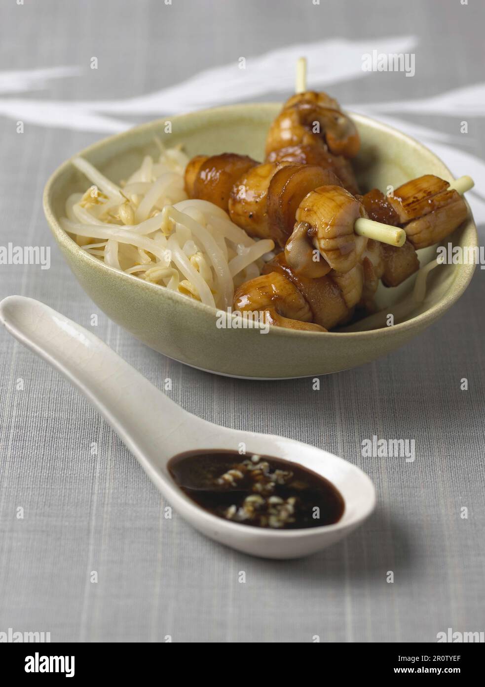 Petoncle scallop skewers with beansprouts Stock Photo - Alamy